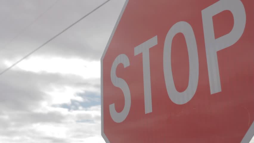 Side View Of A Stop Sign Blowing In The Wind. Stock Footage Video ...