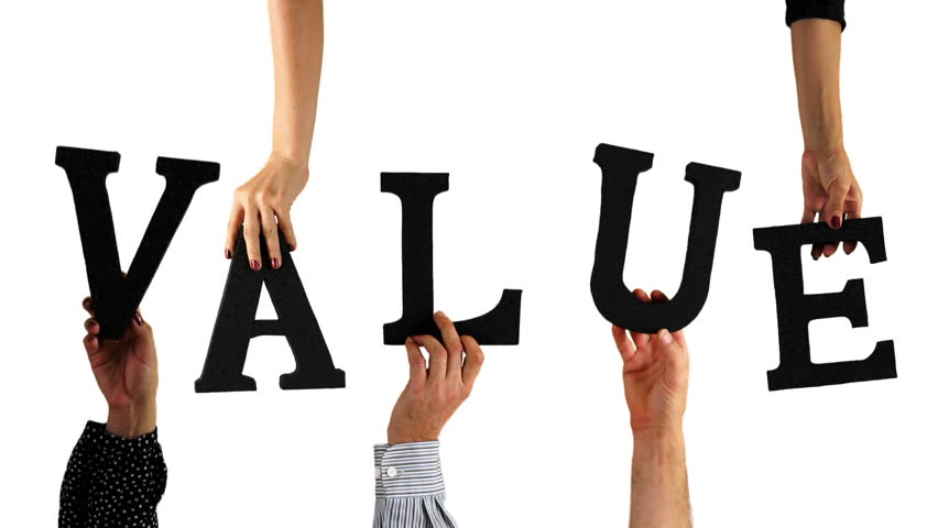People's Hands Holding The Letters That Spell Out The Word VALUE To ...