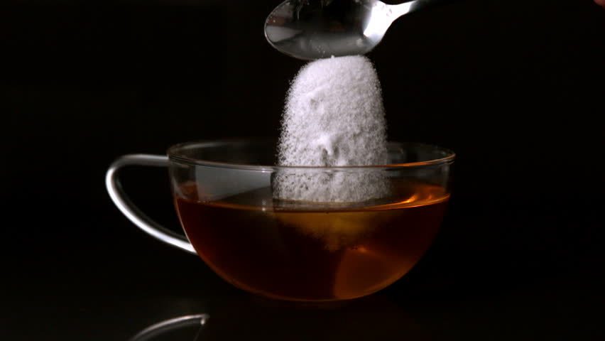 Teaspoon Pouring Sugar Into Cup Of Tea In Slow Motion Stock Footage ...