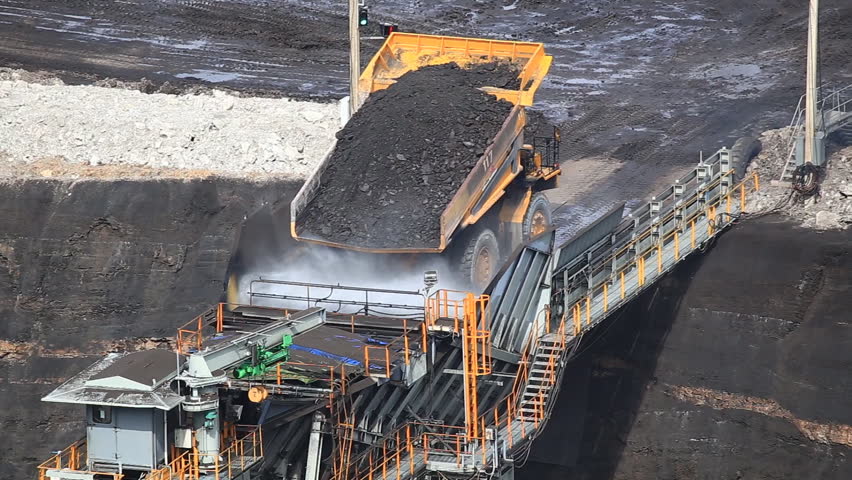 Heavy Construction Tipper Trucks Dump Coal To The Conveyor At Coal Mine ...