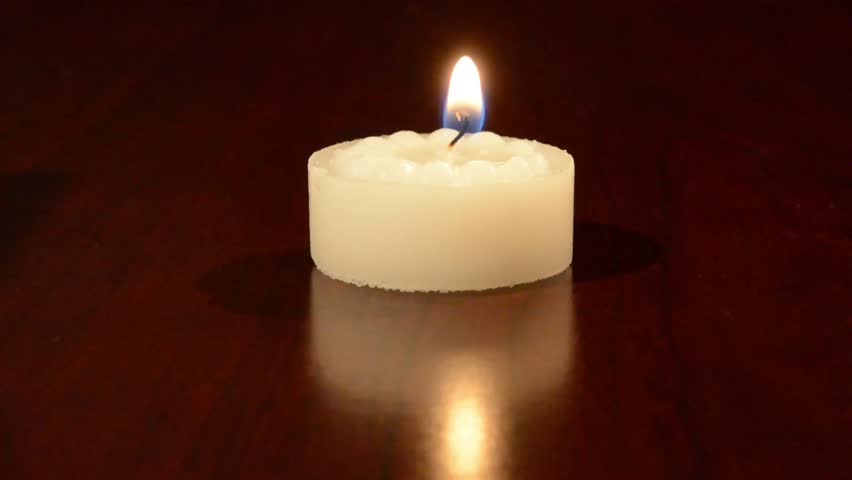 A Single Tea Light Candle Burning Stock Footage Video 8971294 ...